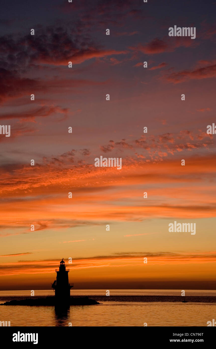 Lighthouse at Orient Point in the evening sunset on Long Island Sound ...
