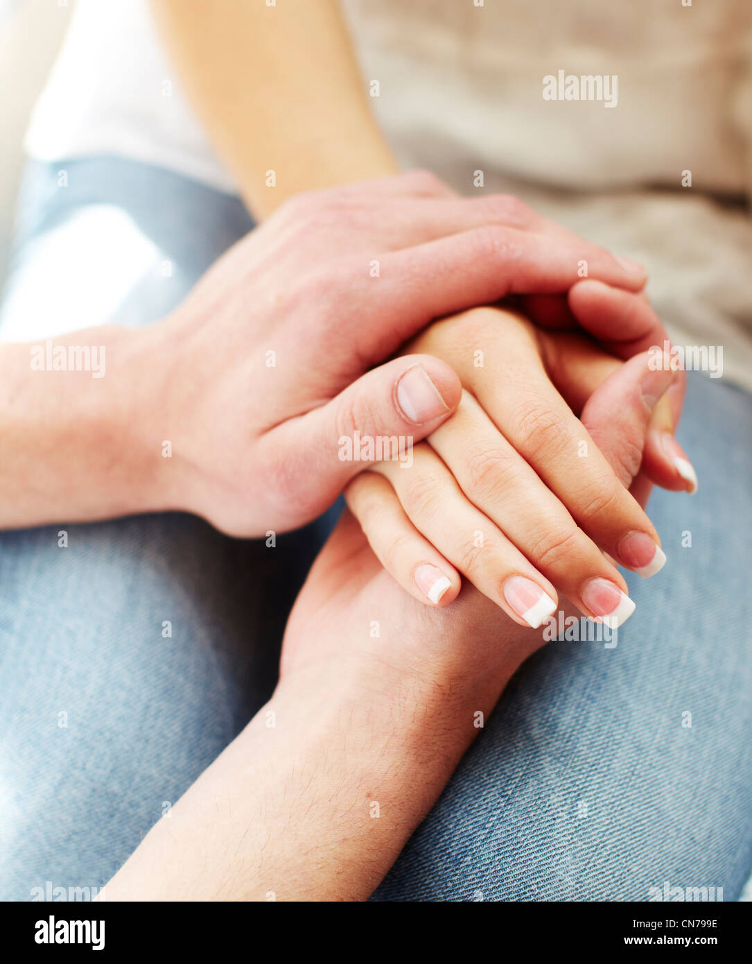 Adolescent couple holding hands hi-res stock photography and images - Alamy