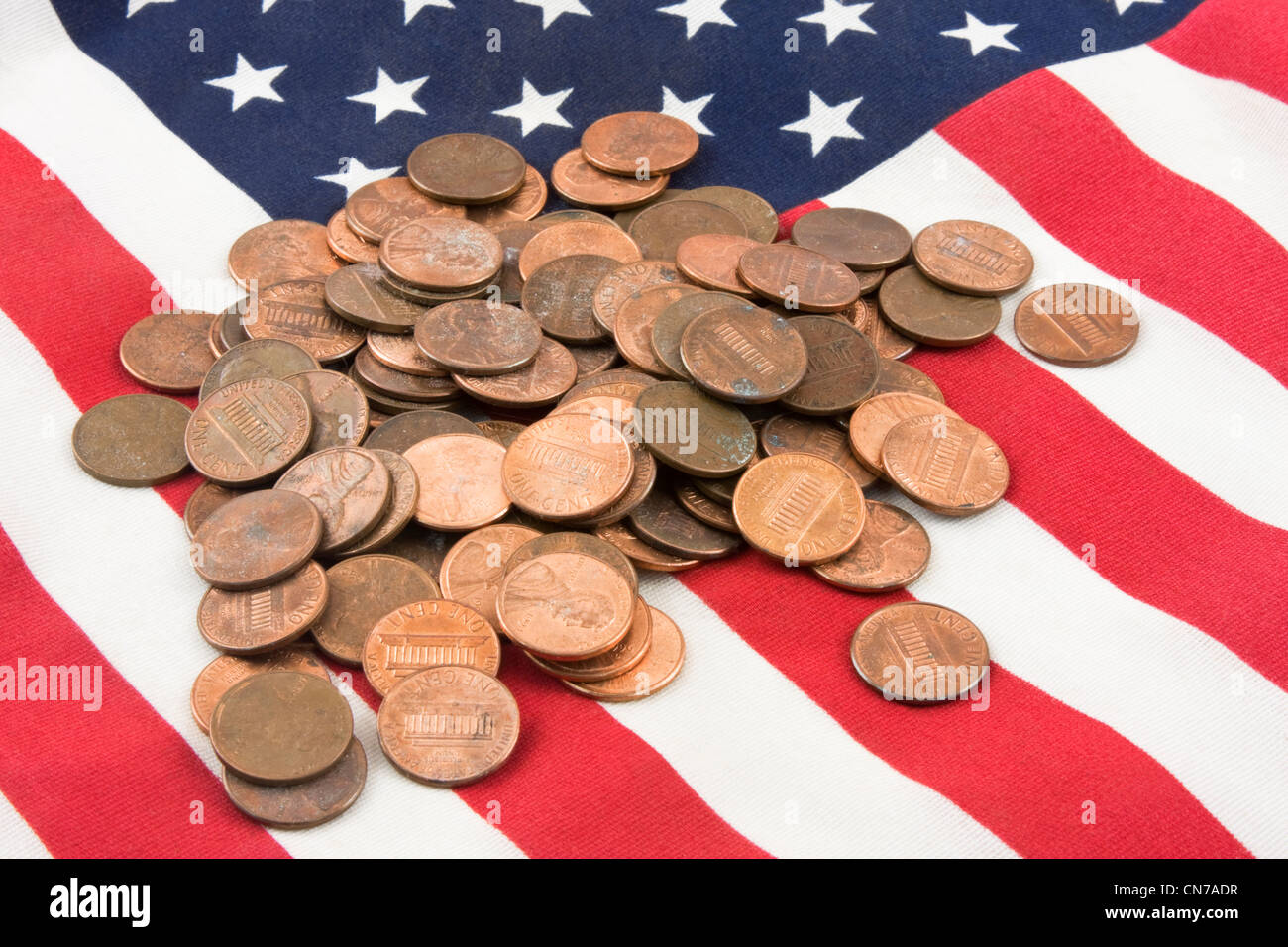 Pile of Pennies on American Flag Stock Photo - Alamy