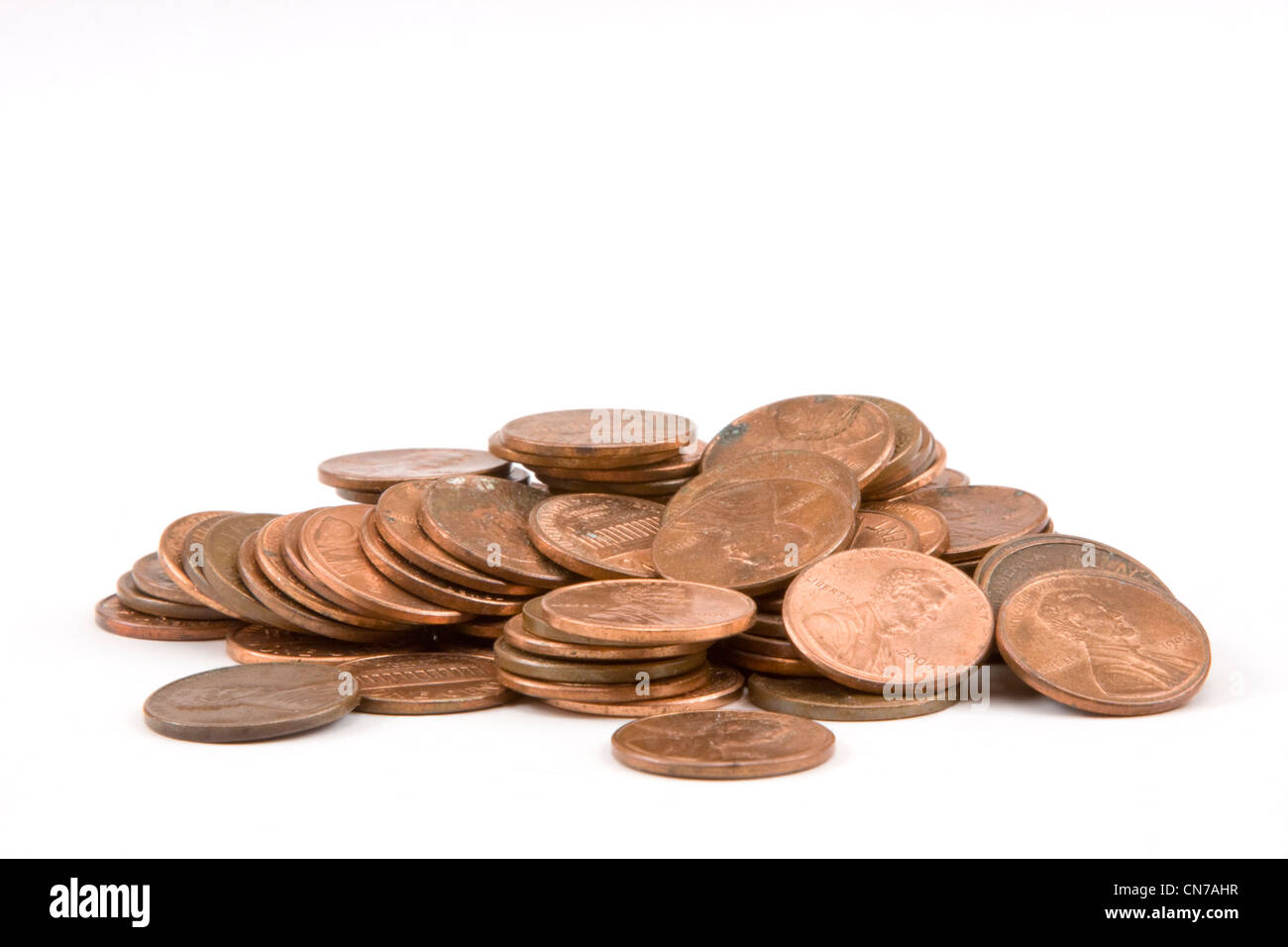 Pile of pennies on white background Stock Photo - Alamy