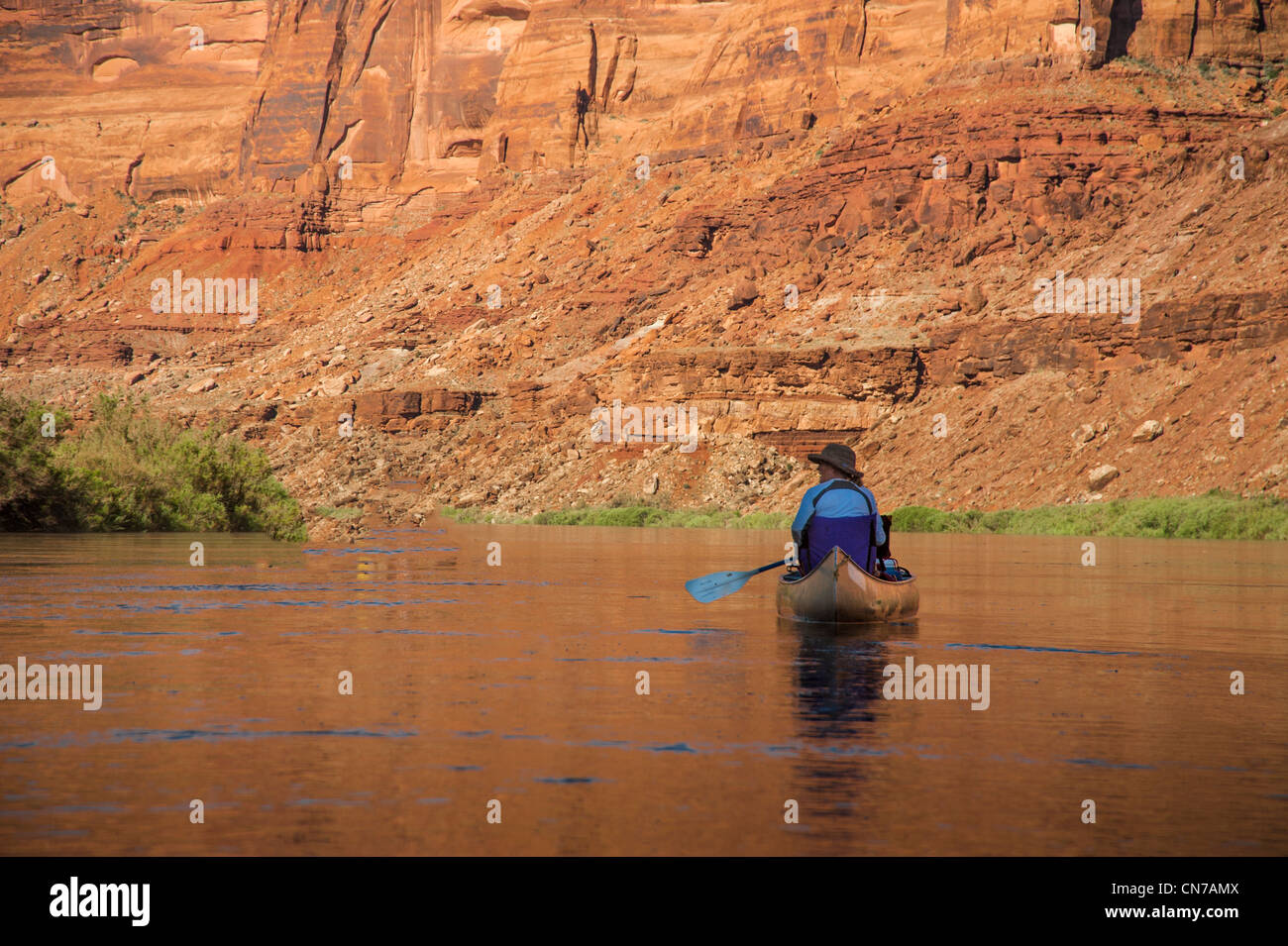 Woman paddlling a canoe on the Colorado River, Utah Stock Photo - Alamy