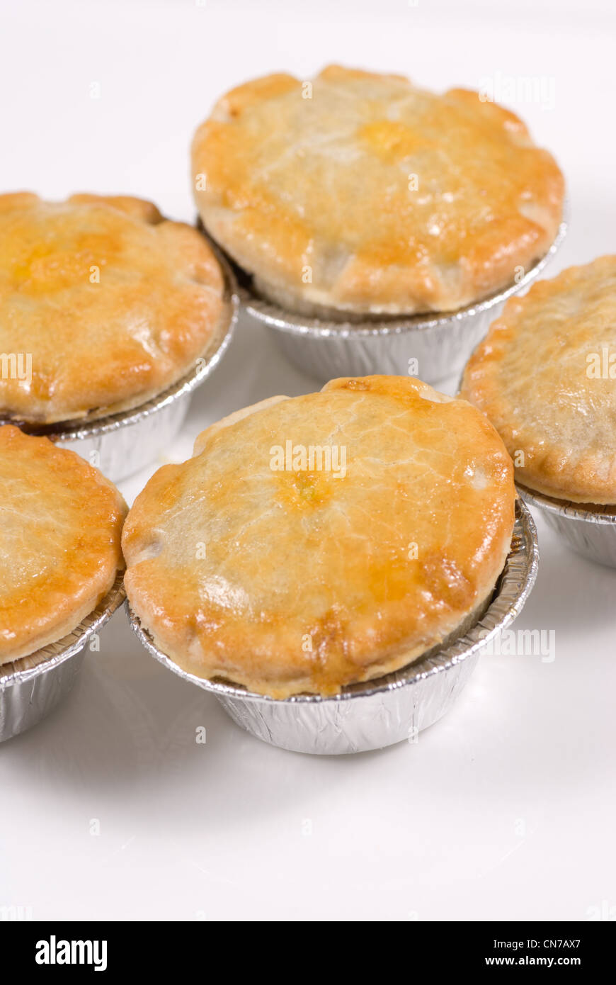 Ready to eat pies on white Stock Photo - Alamy