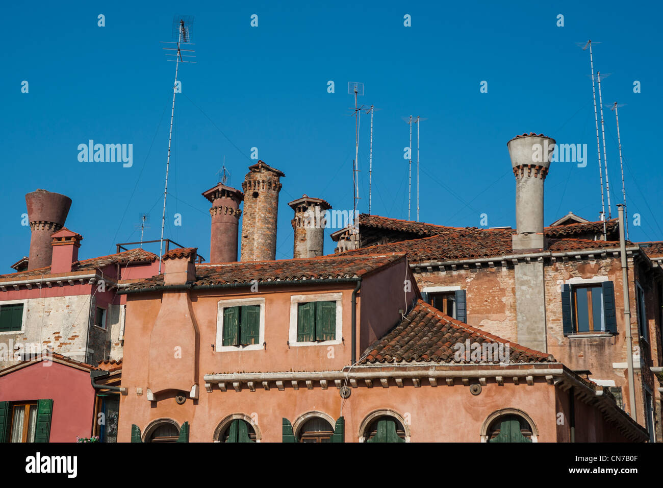 Chimneys and antennae on rooftops in Venice, Italy Stock Photo - Alamy