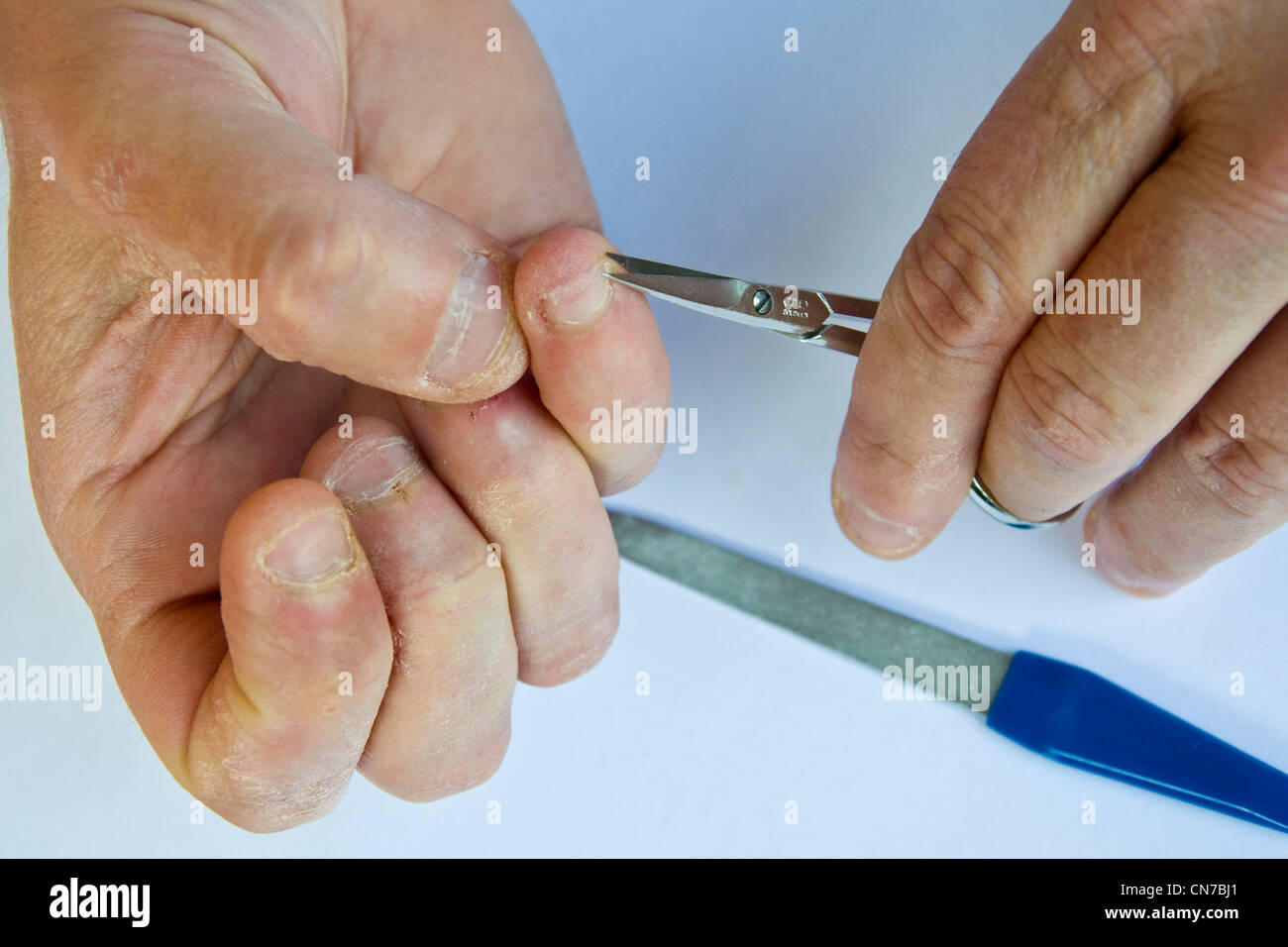 Manicure, man, nail biting Stock Photo - Alamy