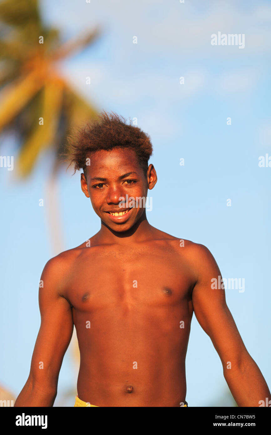 A portrait of a malagasy young man at a typical and remote Vezo fishing ...