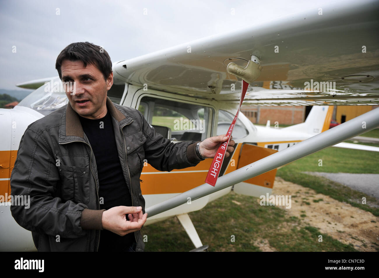 Pilot checking his Cessna A-172 airplane before flight Stock Photo - Alamy