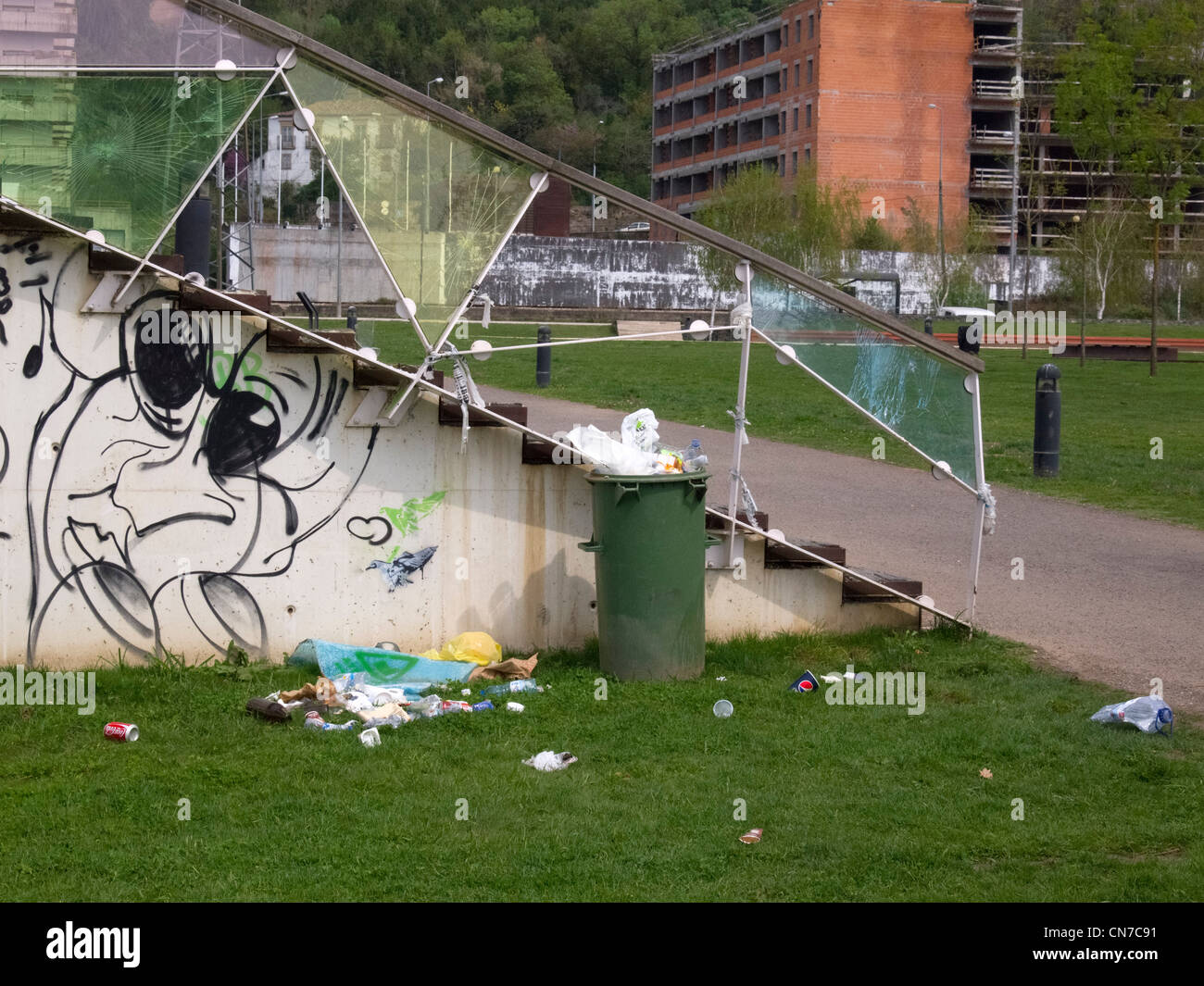 Garbage bags piled next to a wall with graffiti Stock Photo - Alamy