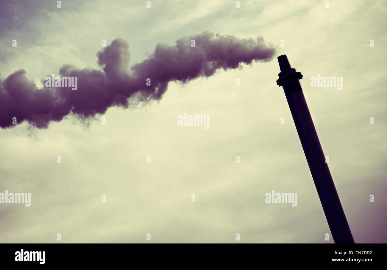 Smoke stack / tower polluting the sky Stock Photo - Alamy