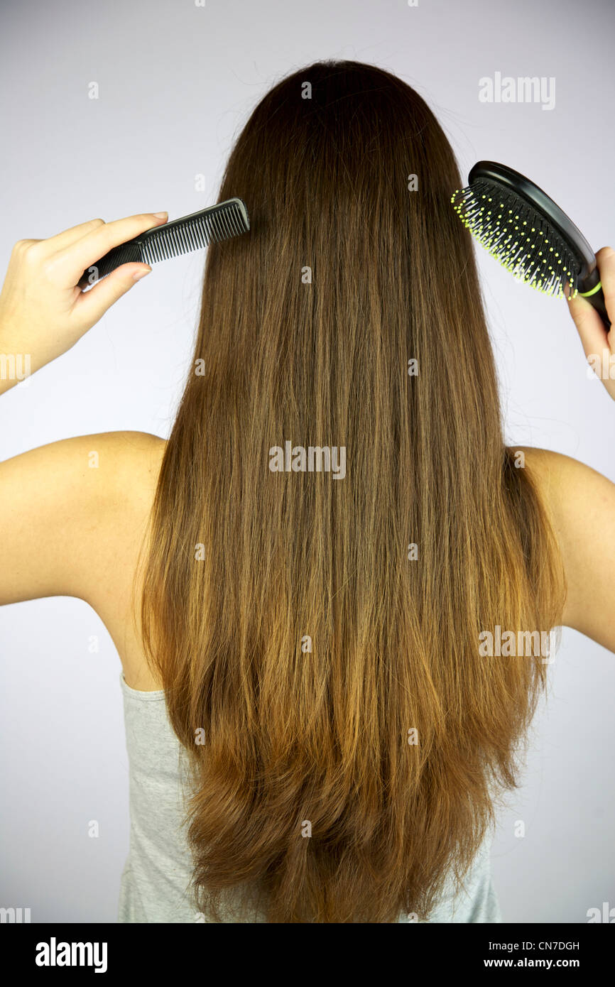Girl with hairbrush and comb Stock Photo - Alamy