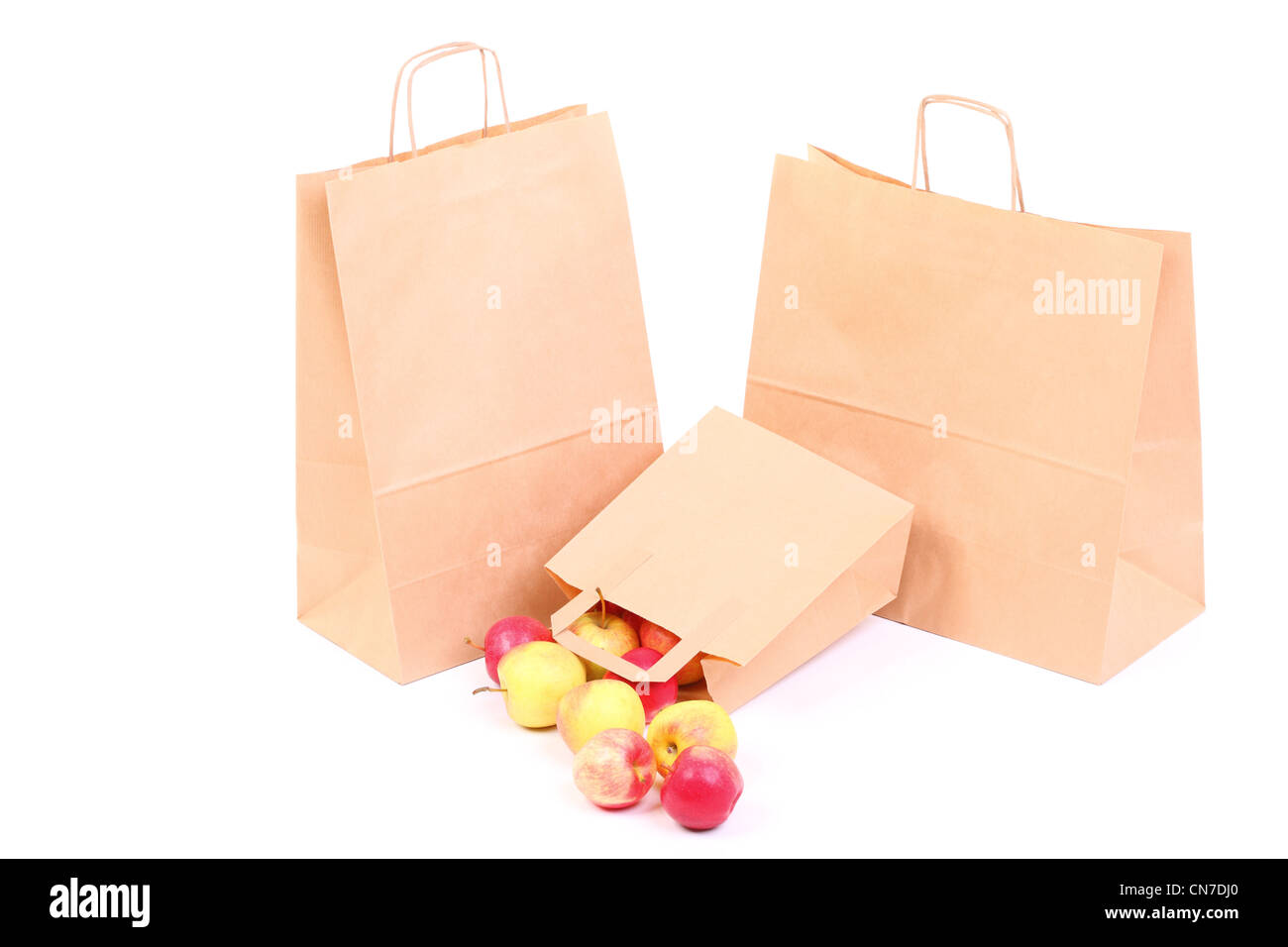 Shopping brown recycle gift bags and red apple isolated on white ...