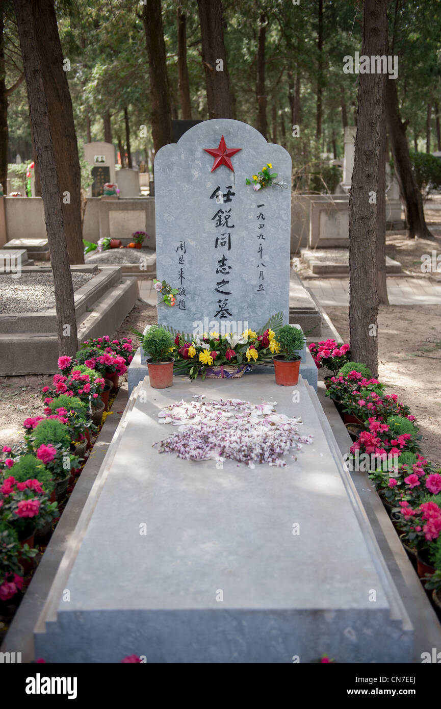 Beijing, Wanan cemetery. Grave with flowers and food offerings during ...