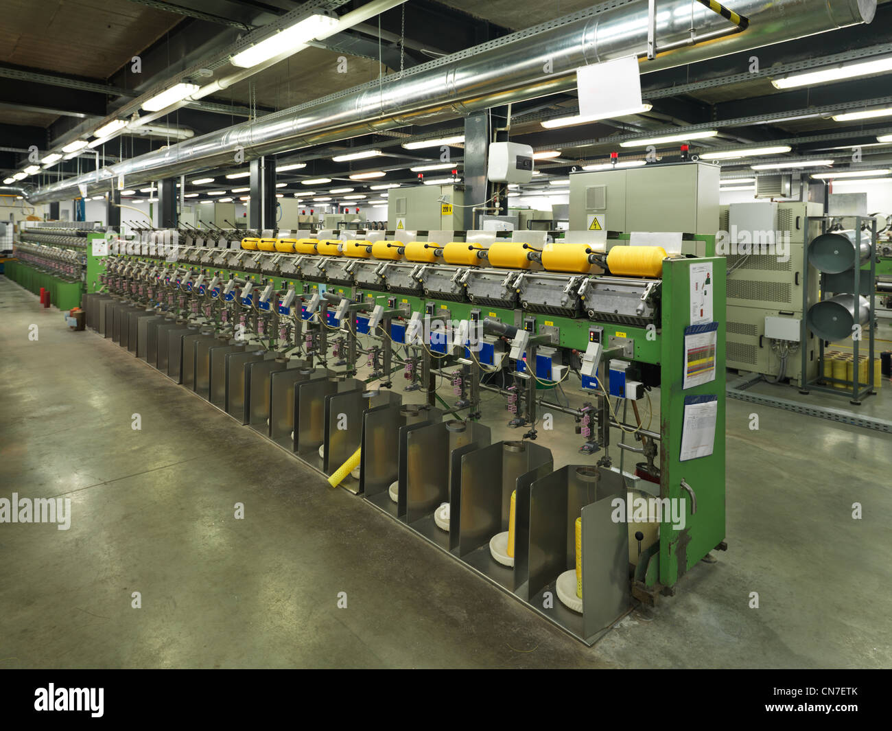 detail of an indoor industrial production line, in a thread factory ...