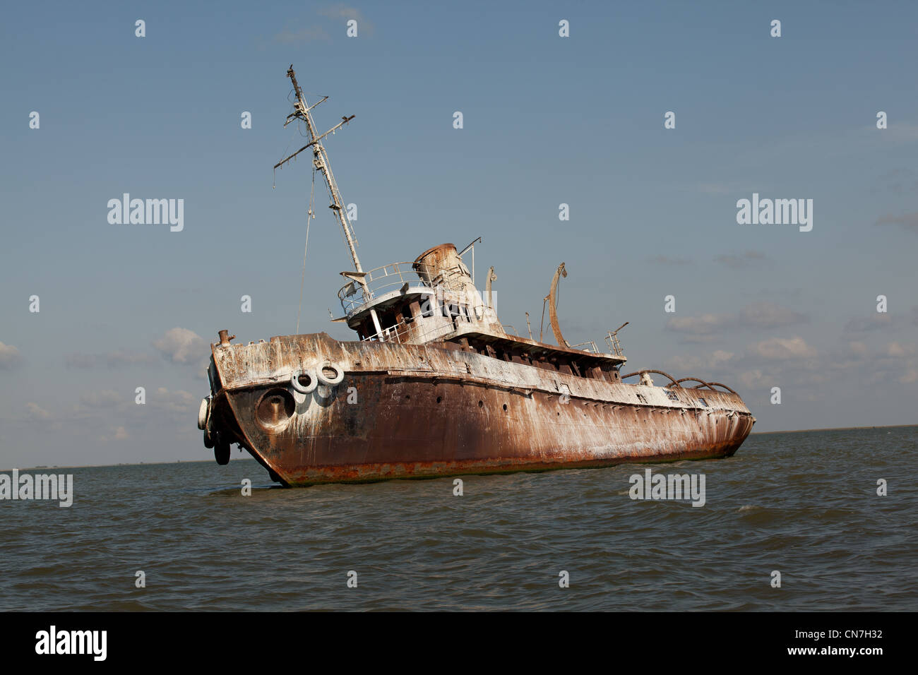 side view of abandoned wrecked ship in seaside landscape Stock Photo ...