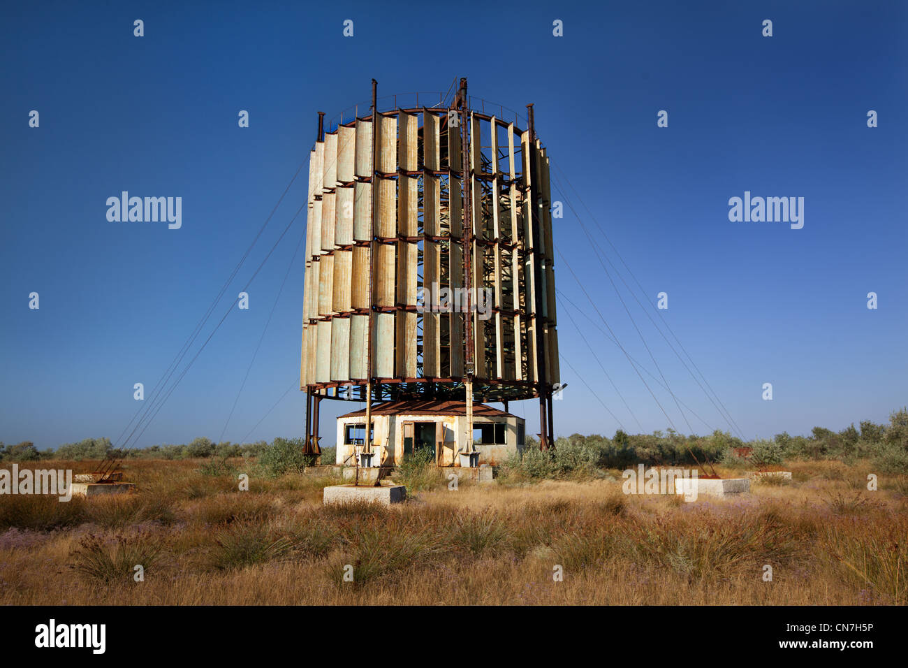 old, rusted windmill in dusty, abandoned landscape Stock Photo - Alamy