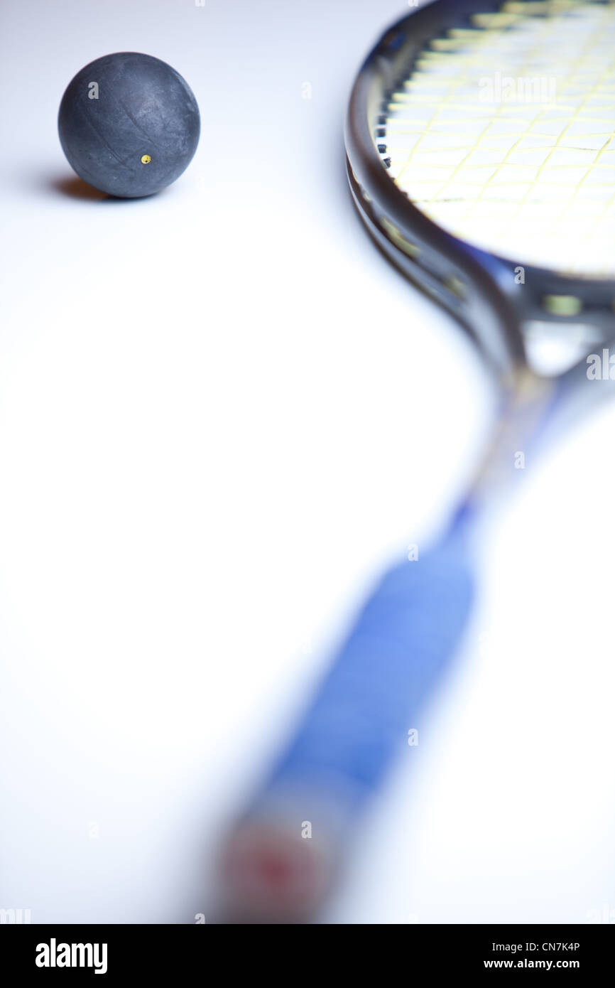 squash ball and a squash racket on white background Stock Photo - Alamy