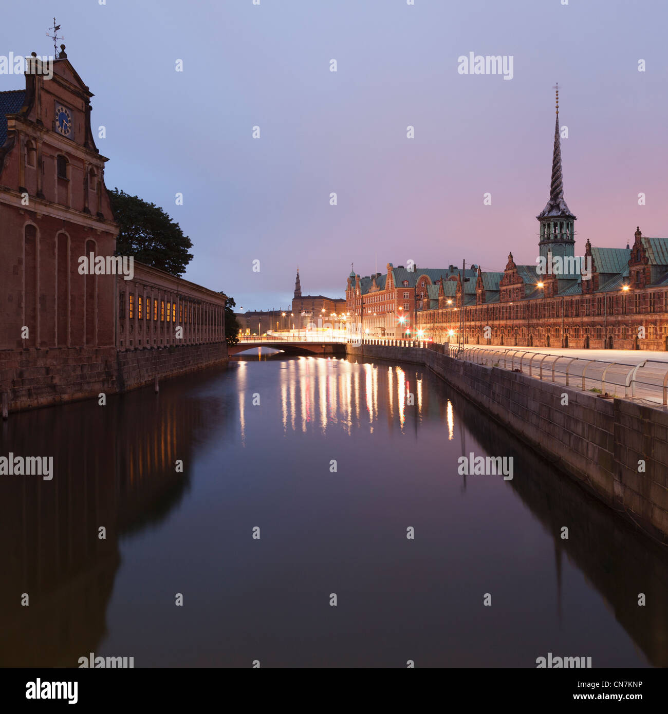 Lit buildings reflected in urban canal Stock Photo - Alamy