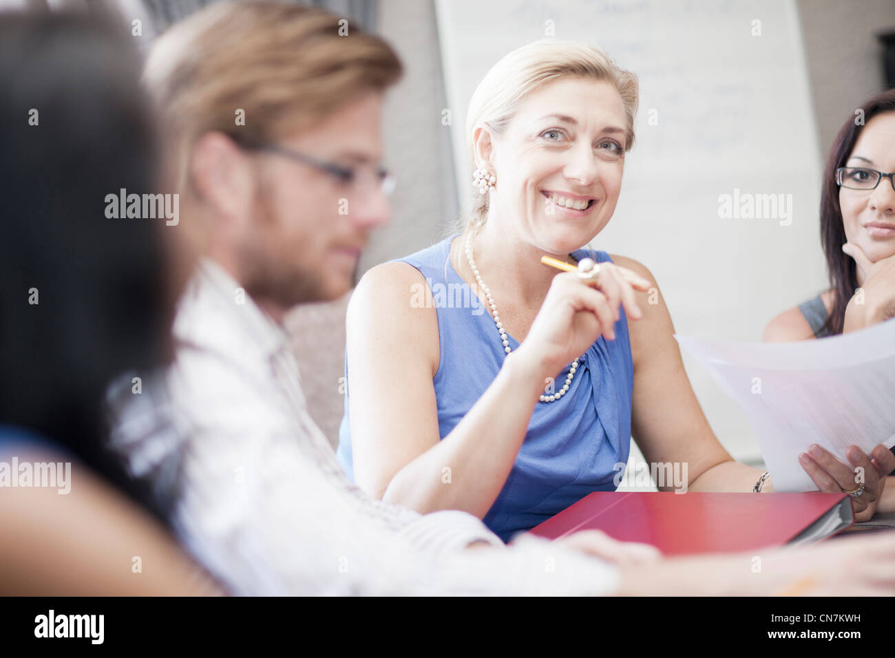 Four women collaborating conference table hi-res stock photography and ...