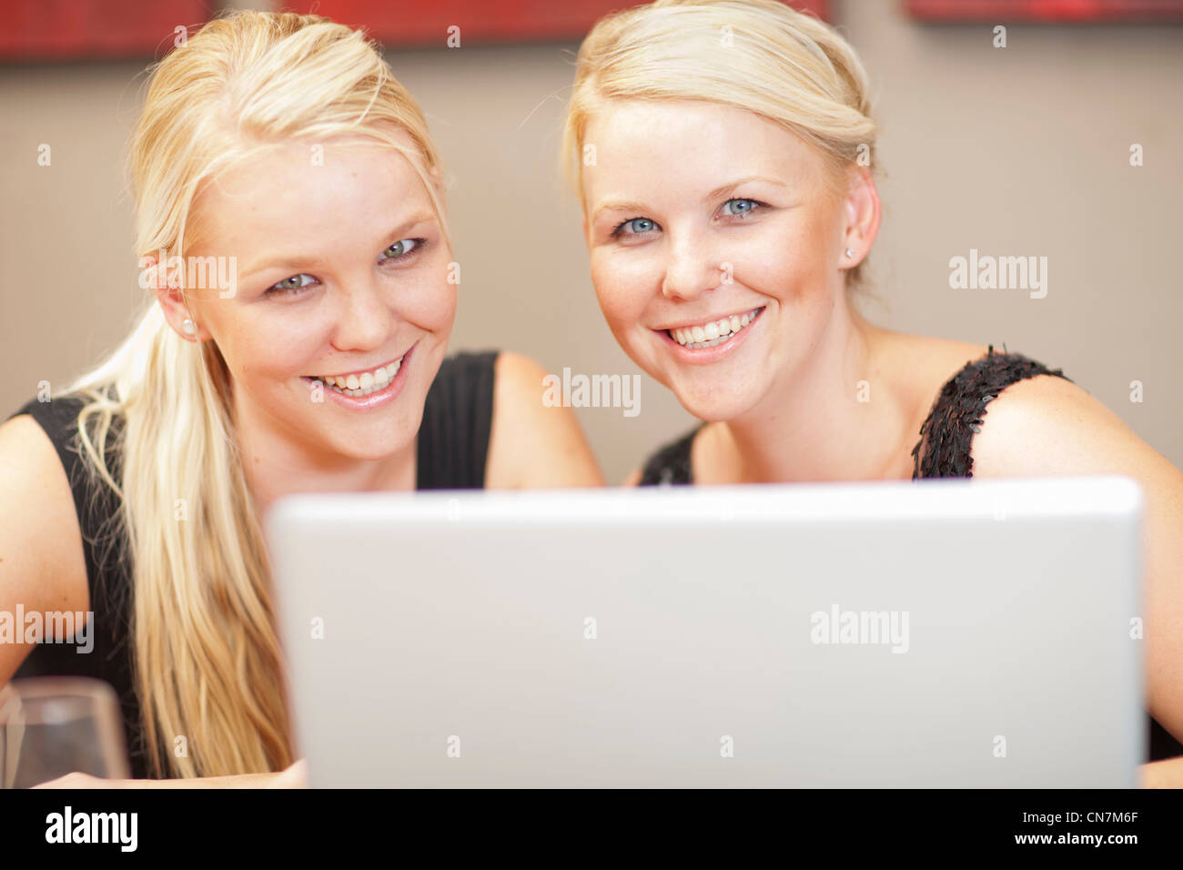 Twin businesswomen working together Stock Photo - Alamy