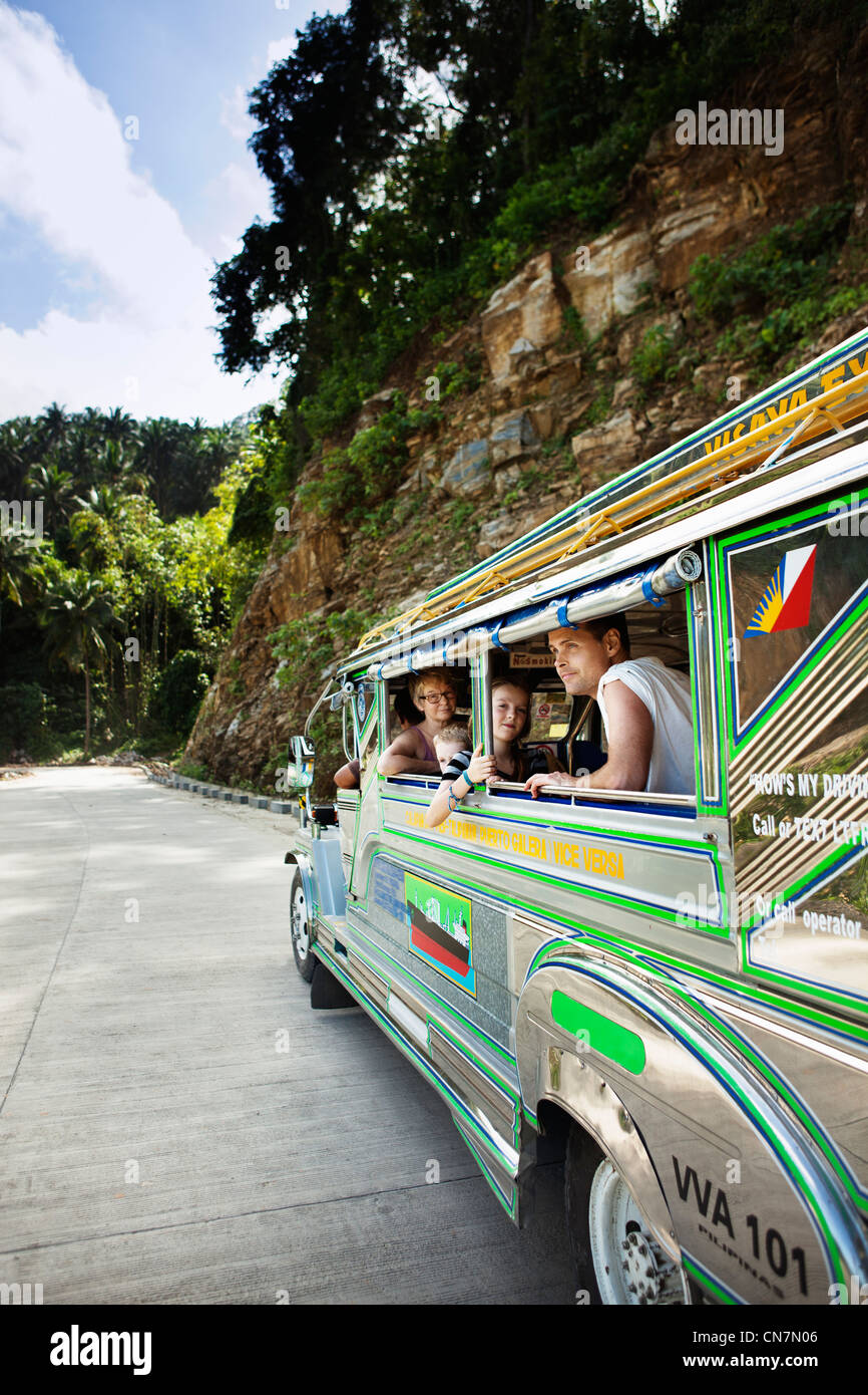 Passengers sitting by bus window Stock Photo - Alamy