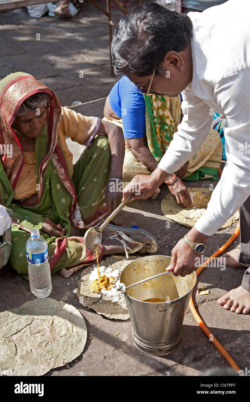 Man serving a thali (traditional indian meal). Nasik. India Stock Photo ...