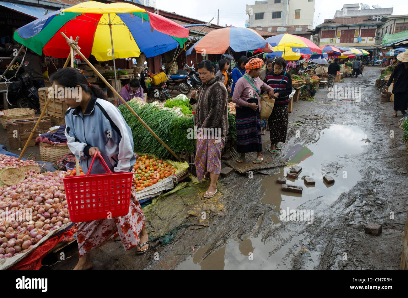 Muddy alleyway in the daily vegetable market. Augban. Southern Shan ...