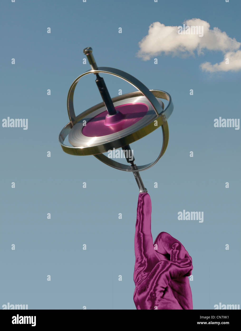 Gyroscope balancing on a finger Stock Photo - Alamy