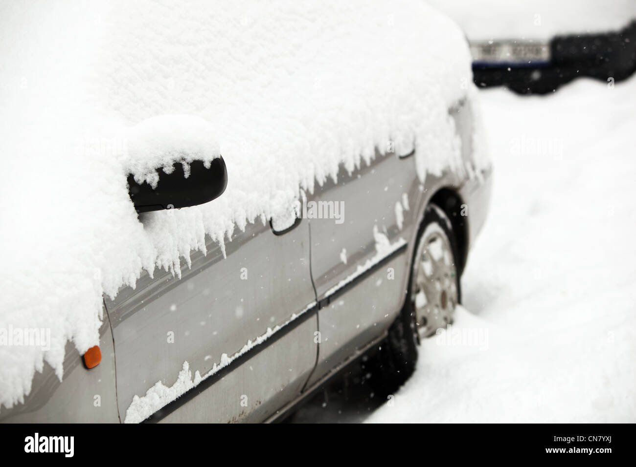 cars covered with snow after a heavy snowfall in a city Stock Photo - Alamy
