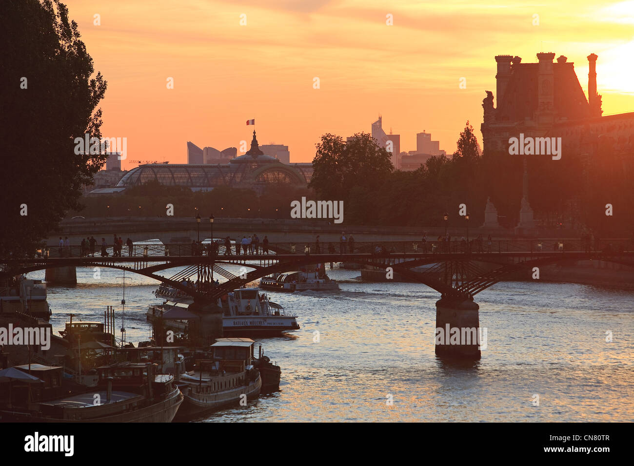 France, Paris, sunset over the pedestrian footbridge Passerelle des ...