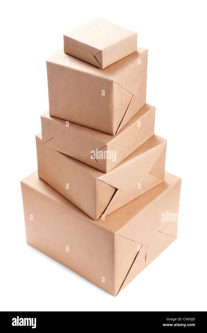 Stack of parcel wrapped with brown packing paper isolated on white ...