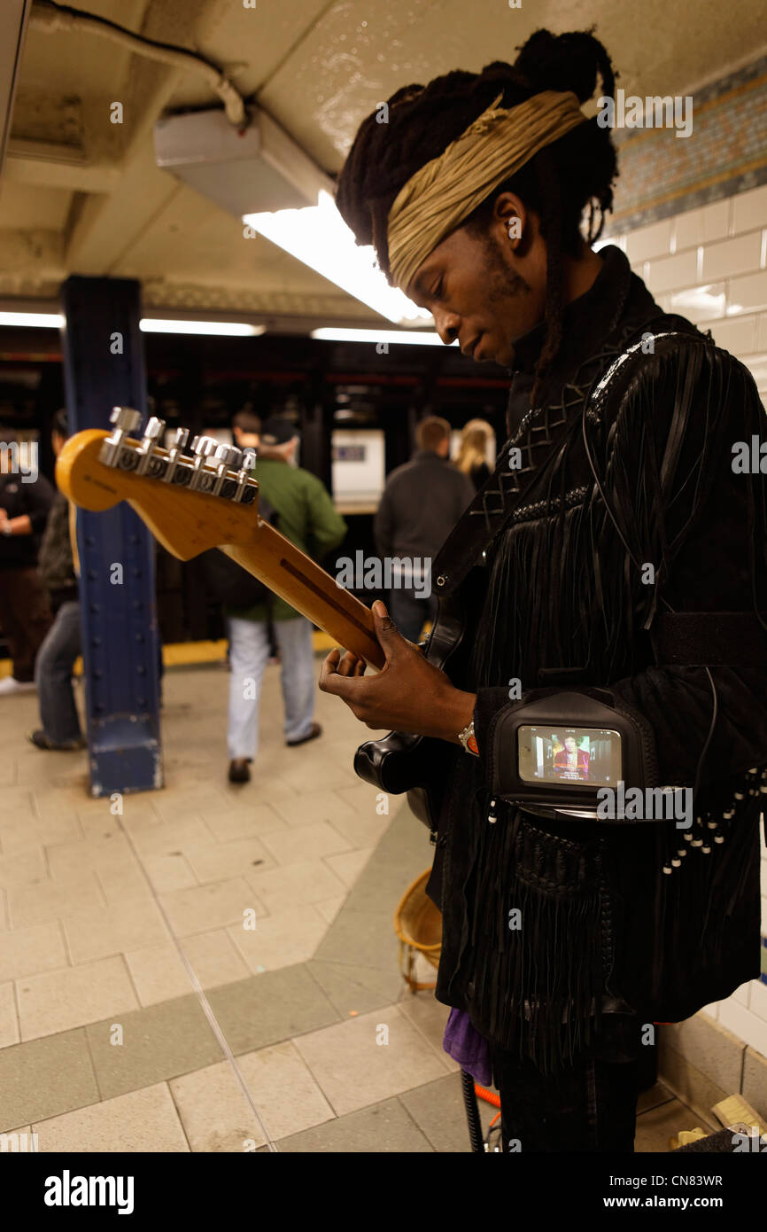 United States, New York City, Manhattan, guitarist in a subway station ...