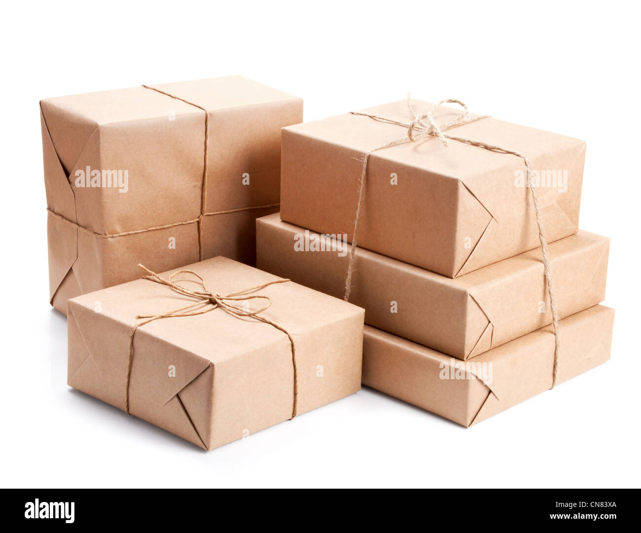 Group of parcel wrapped with brown packing paper isolated on white ...