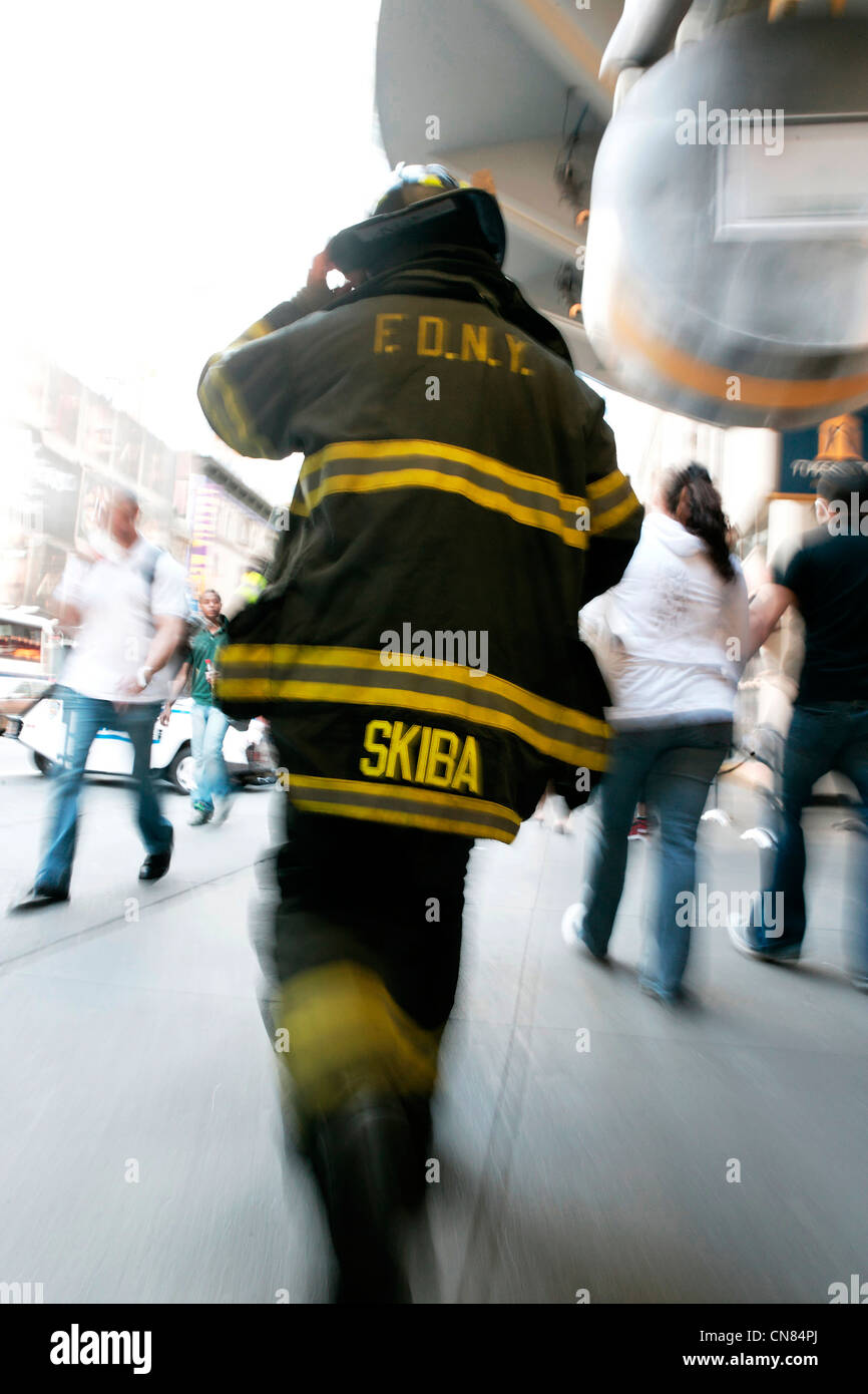 United States, New York City, Manhattan, fireman walking on the ...