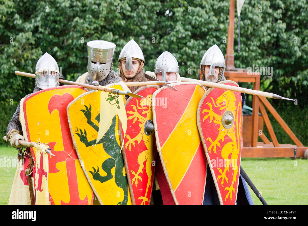 "History in action" re-enactment. Five knights in a defensive stance ...