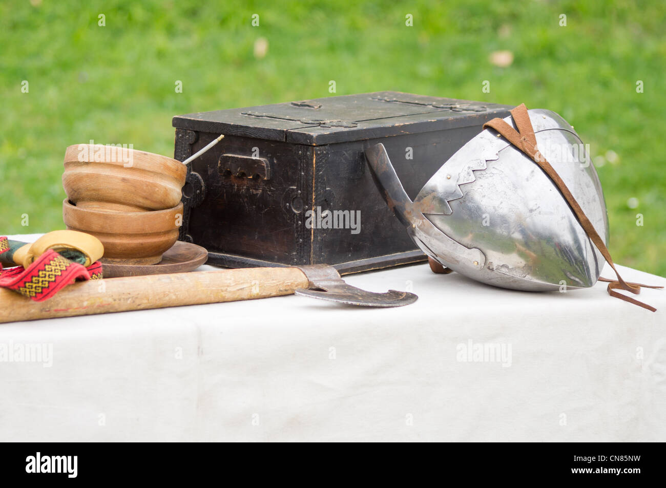 Still life picture of medieval items on a table including an Axe ...