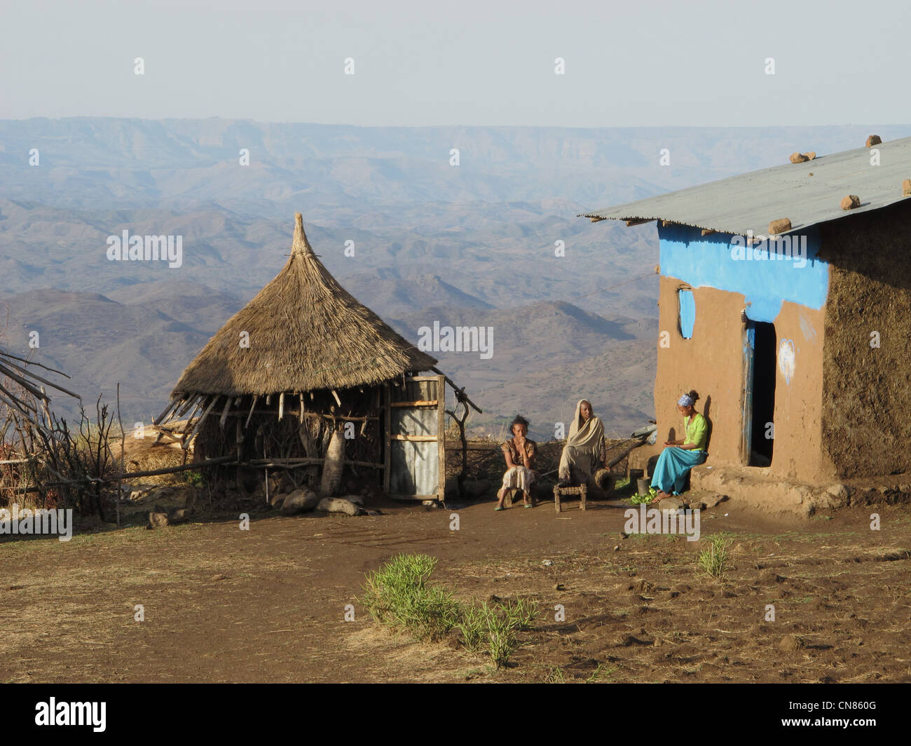 Family by their traditional Tukul dwelling in the Meket mountains, near ...