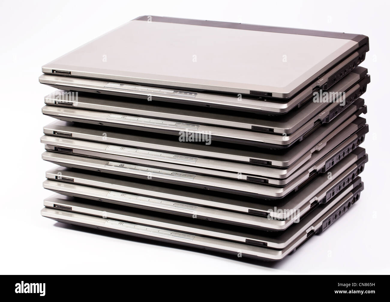 Pile of laptops on the white background Stock Photo - Alamy