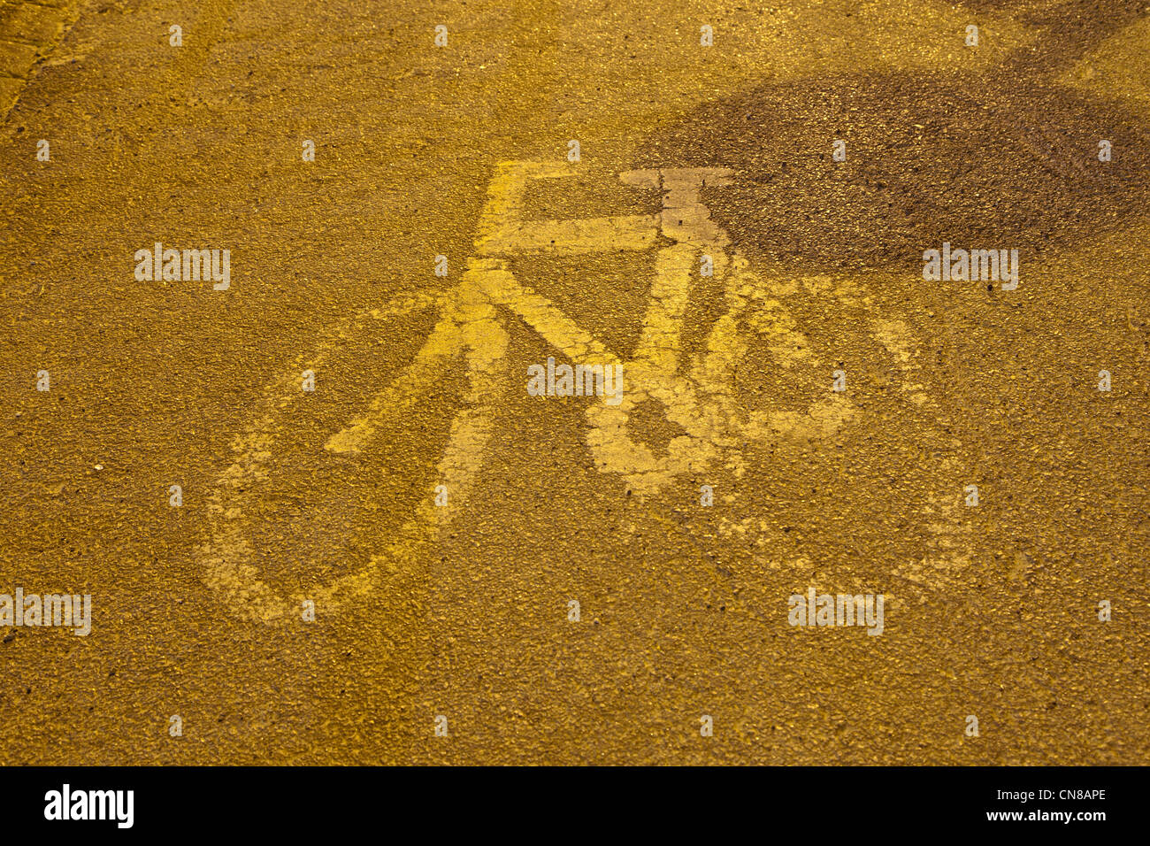 Bike lane shot at night showing the old painted bicycle sign Stock ...