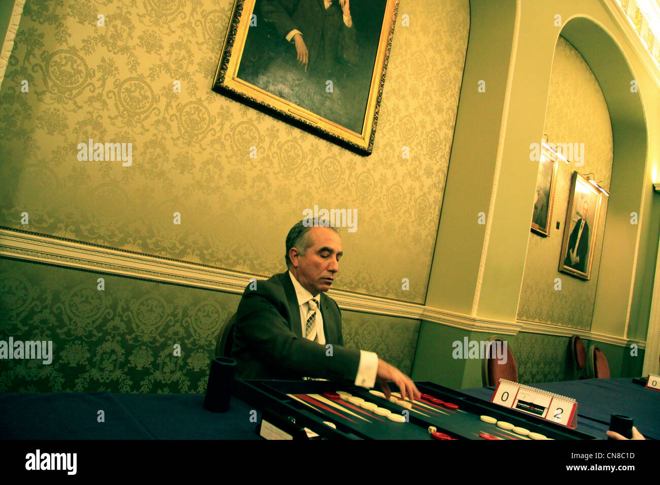 Man playing backgammon in a London club Stock Photo - Alamy