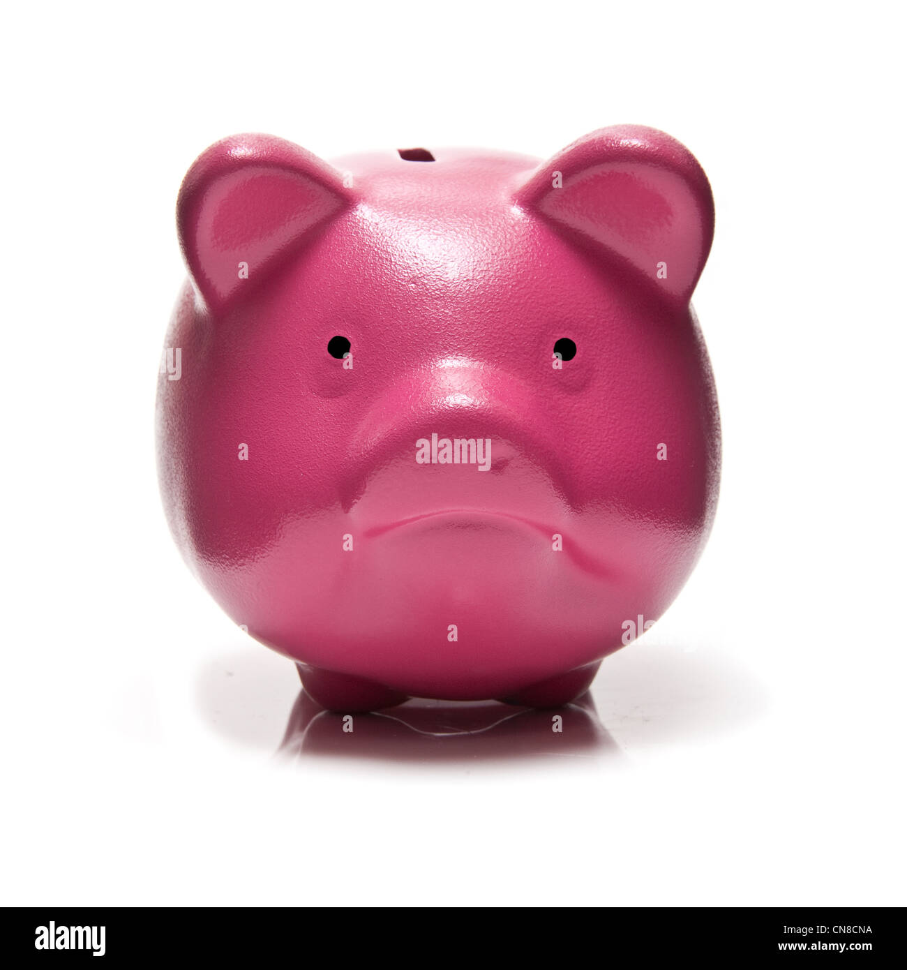Pink piggy bank or money box isolated on a white studio background ...