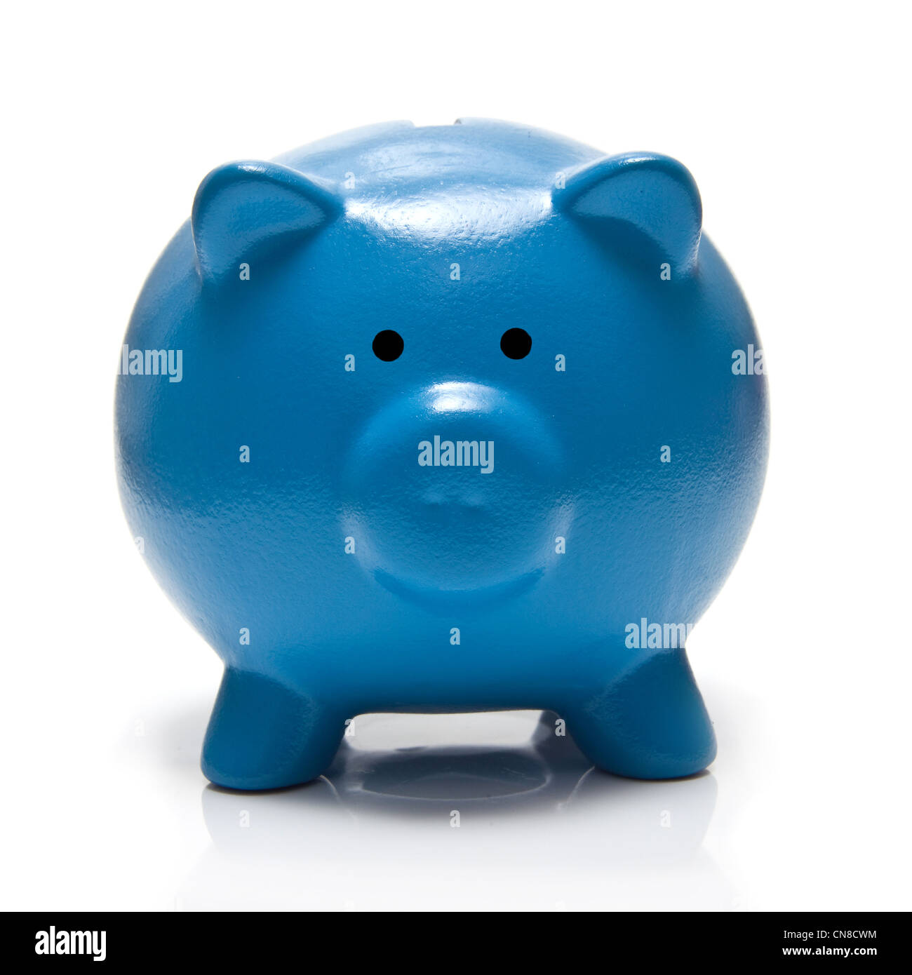 Blue piggy bank or money box isolated on a white studio background ...