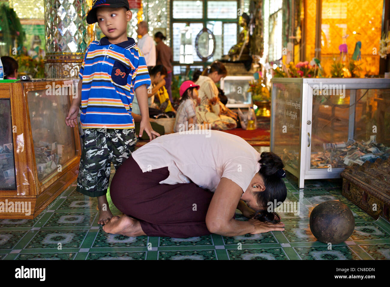 A Burmese woman worships at Botataung Paya in Rangoon, Burma Stock Photo - Alamy