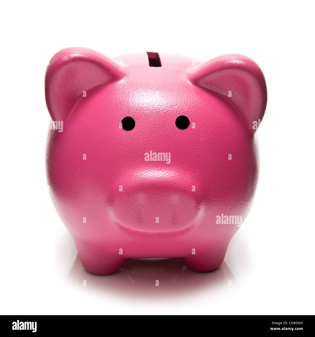 Pink piggy bank or money box isolated on a white studio background ...