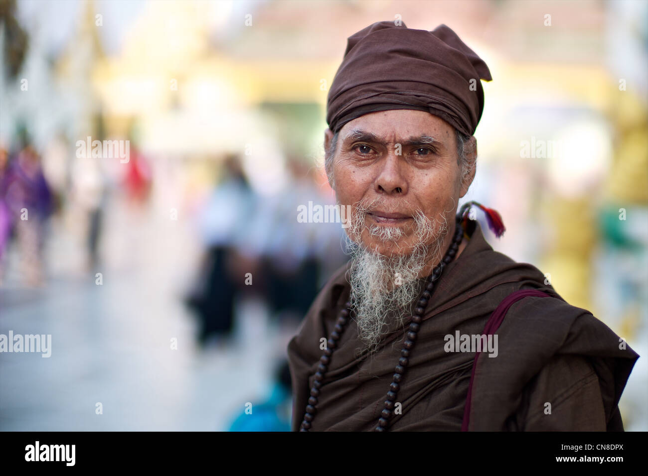 Portrait of a Burmese holy man in the Shwedagon Paya in Rangoon Burma ...