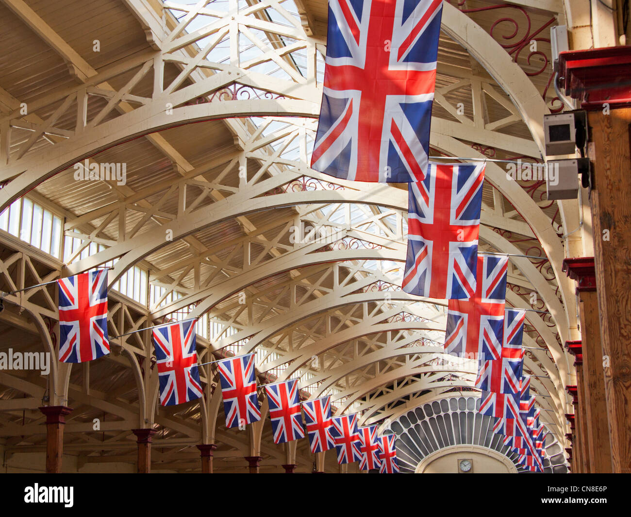 Lines of Union Jack flags adorn an English market hall in advance of ...