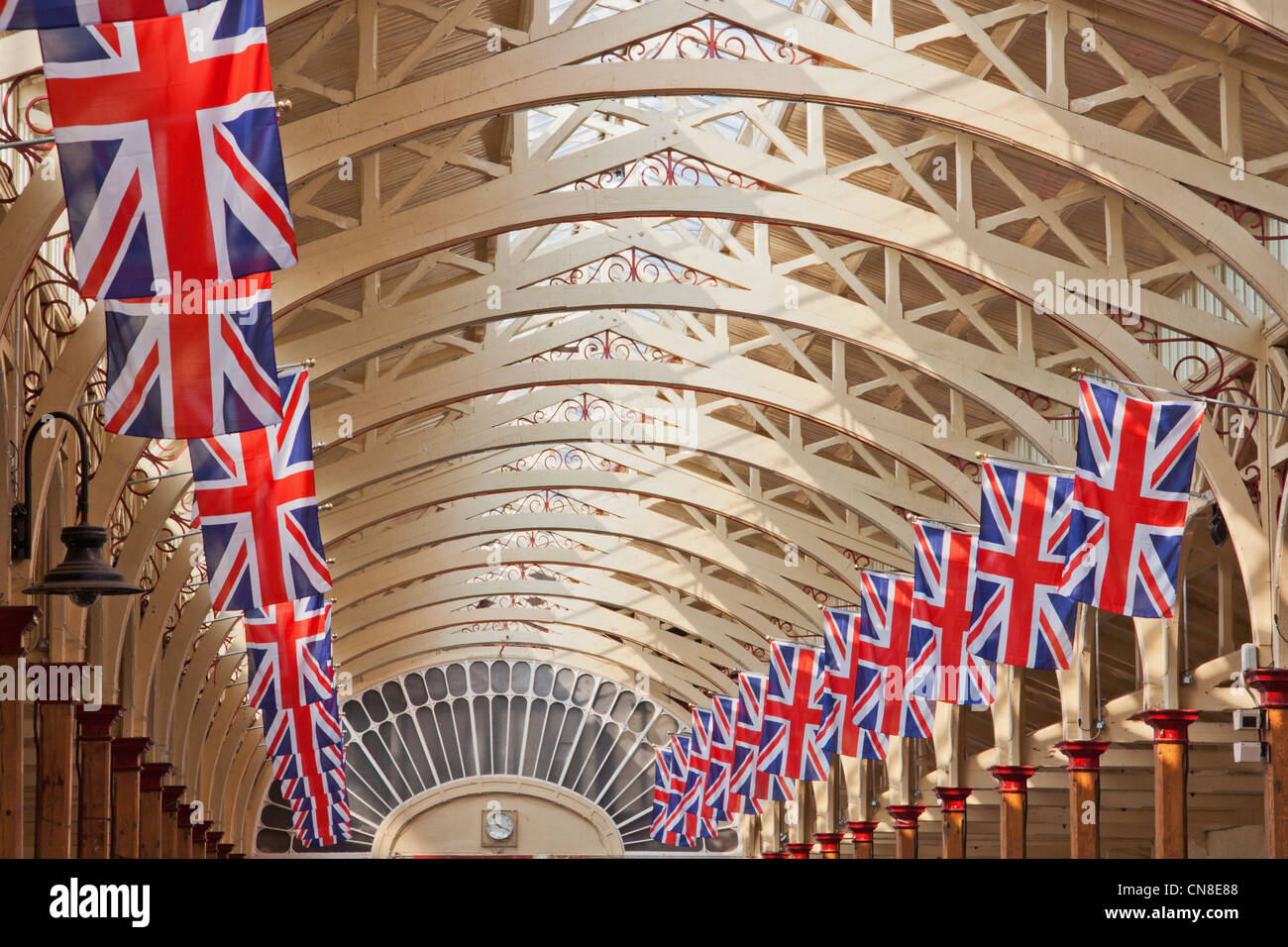 Lines of Union Jack flags adorn an English market hall in advance of ...