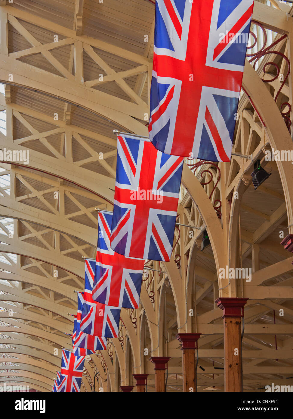 A line of Union Jack flags adorns an English market hall in advance of ...