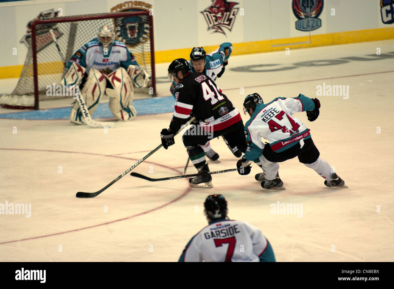 Josh Batch of Cardiff Devils, in black, attacking the goal with Adam ...