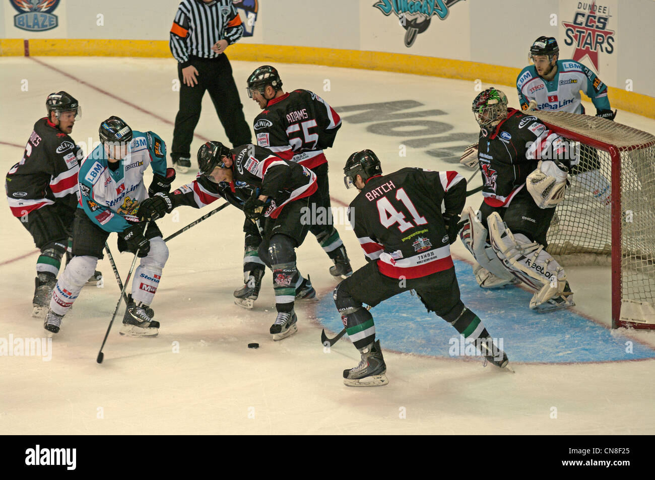 Cardiff Devils, in black, defending in front of their net against ...