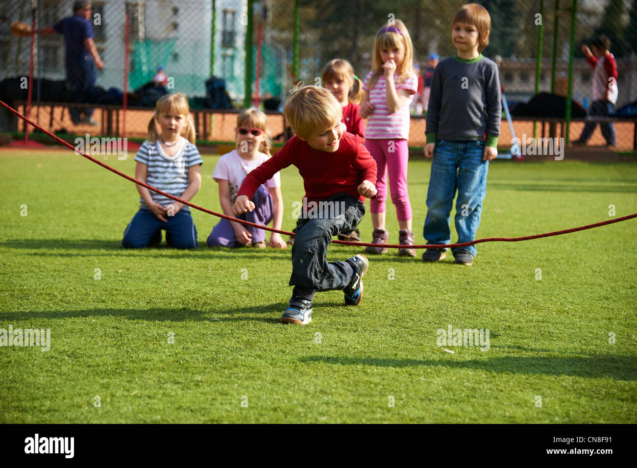 Group of preschool children do sports on sports field outside Stock ...