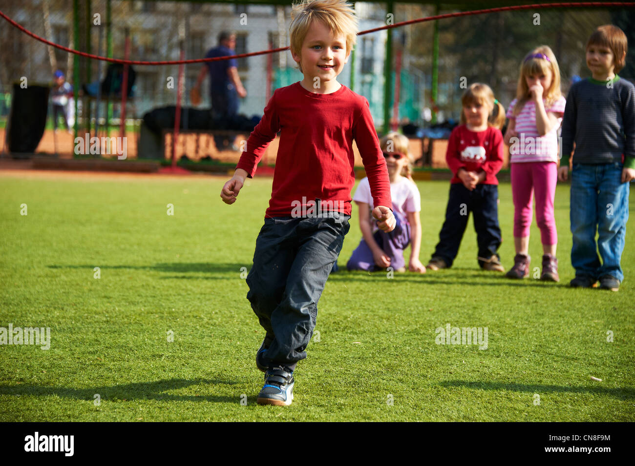 Group of preschool children do sports on sports field outside Stock ...